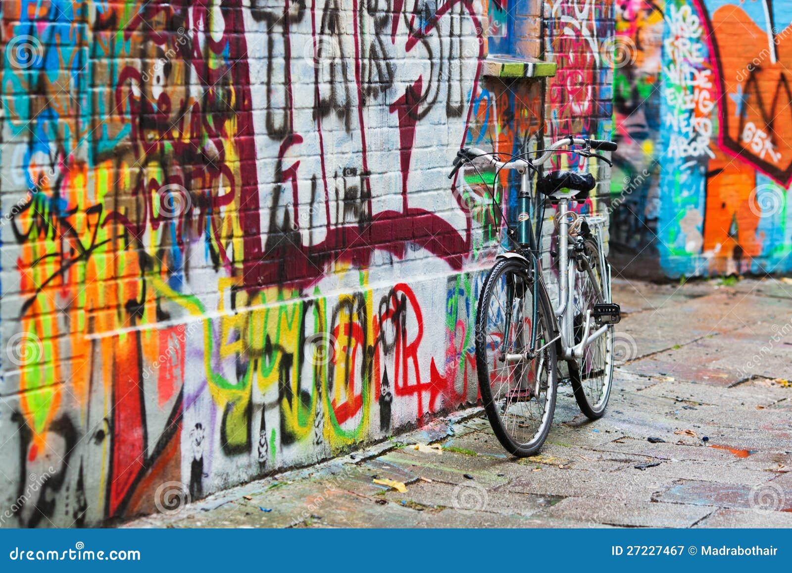 Bicycle Stands at a Graffiti Wall Stock Image - Image of wall, criminal ...