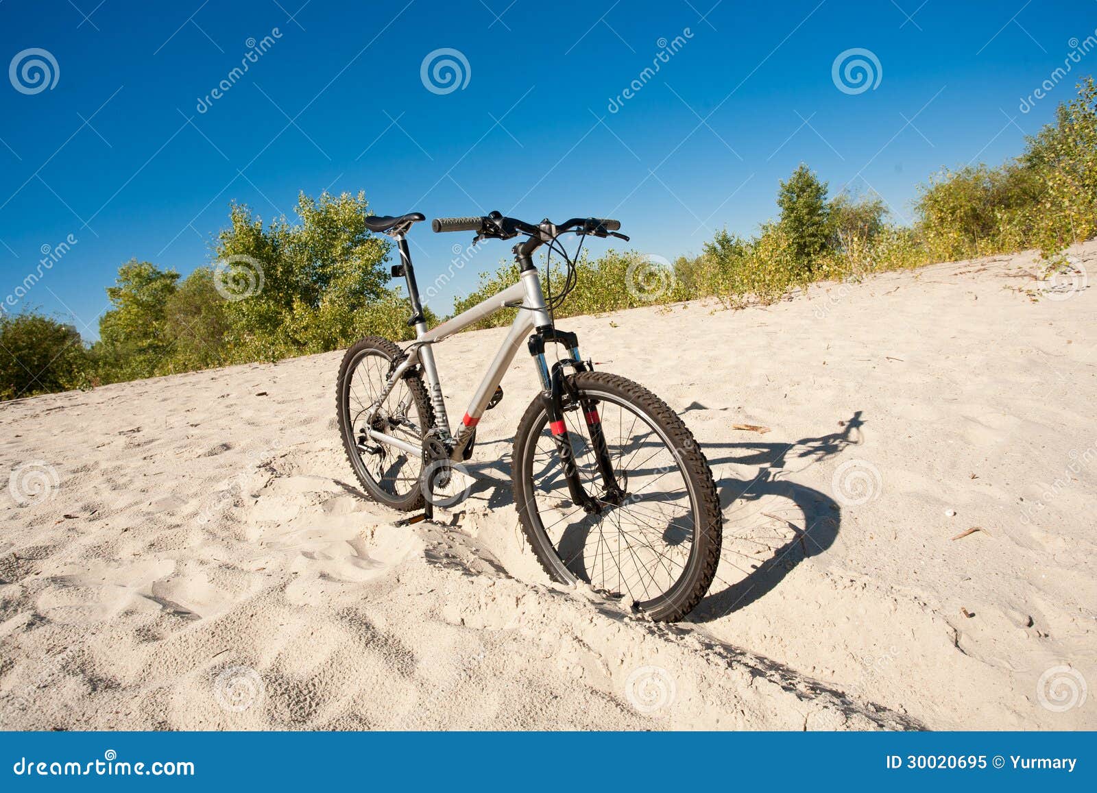 Bicycle stands on sand stock image. Image of mountain - 30020695