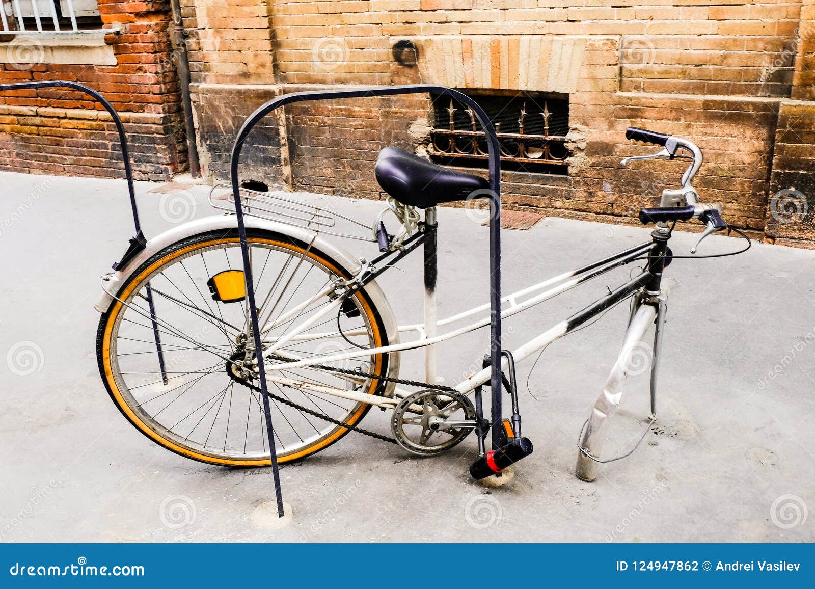 Bicycle with a Stolen Front Wheel is Chained To a Bicycle Parking Lot ... Bicycle with a Stolen Front Wheel is Chained To a Bicycle Parking Lot ...