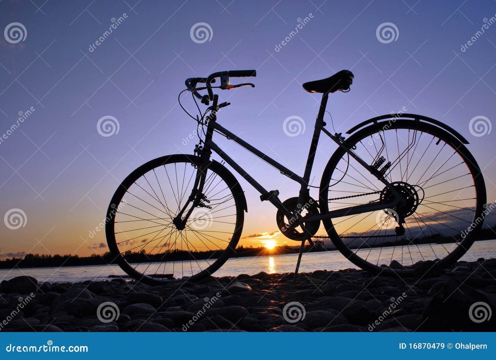 Bicycle at Sunset Lake stock image. Image of exercise - 16870479