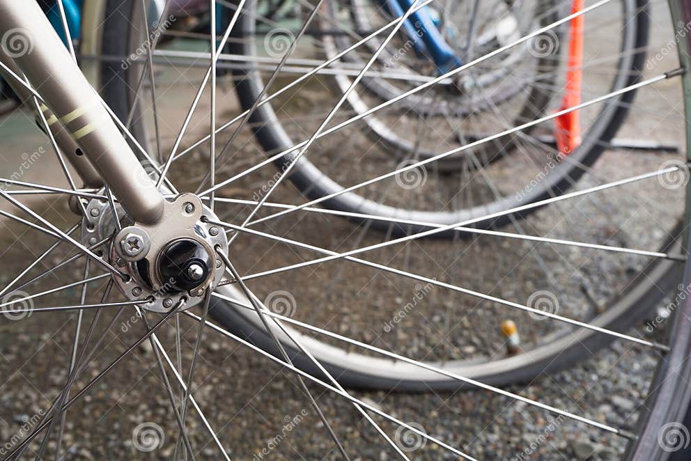 Bicycle wheel on ground. stock image. Image of break - 77946705