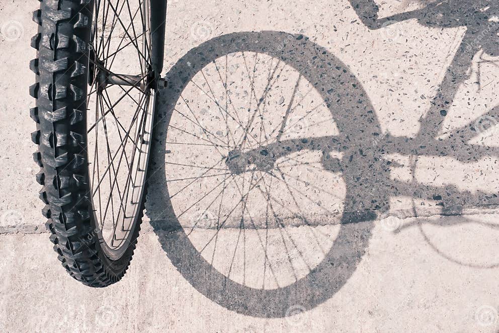 Bicycle wheel and shadow stock image. Image of abstract - 58505641