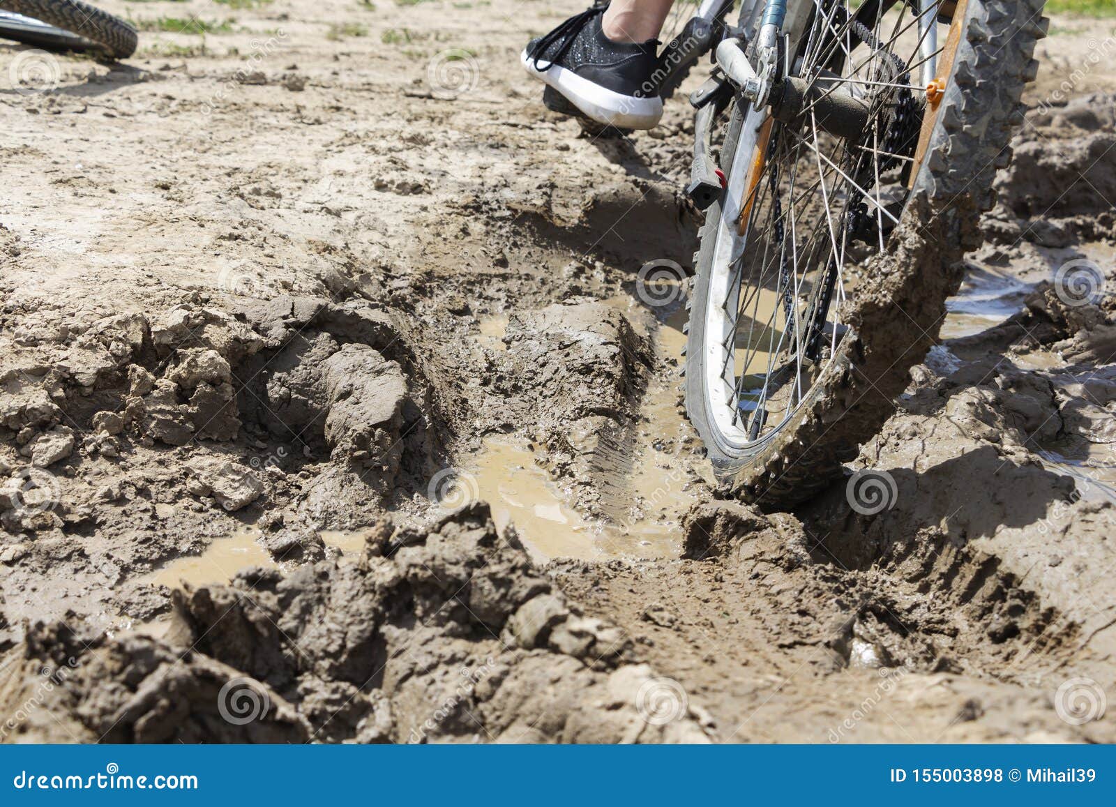 The Bicycle Wheel is Stuck in the Mud. Close Up Stock Photo - Image of ...