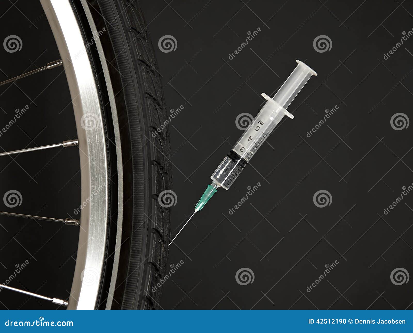 Bicycle Wheel with a Syringe in it Stock Photo - Image of syringe ...