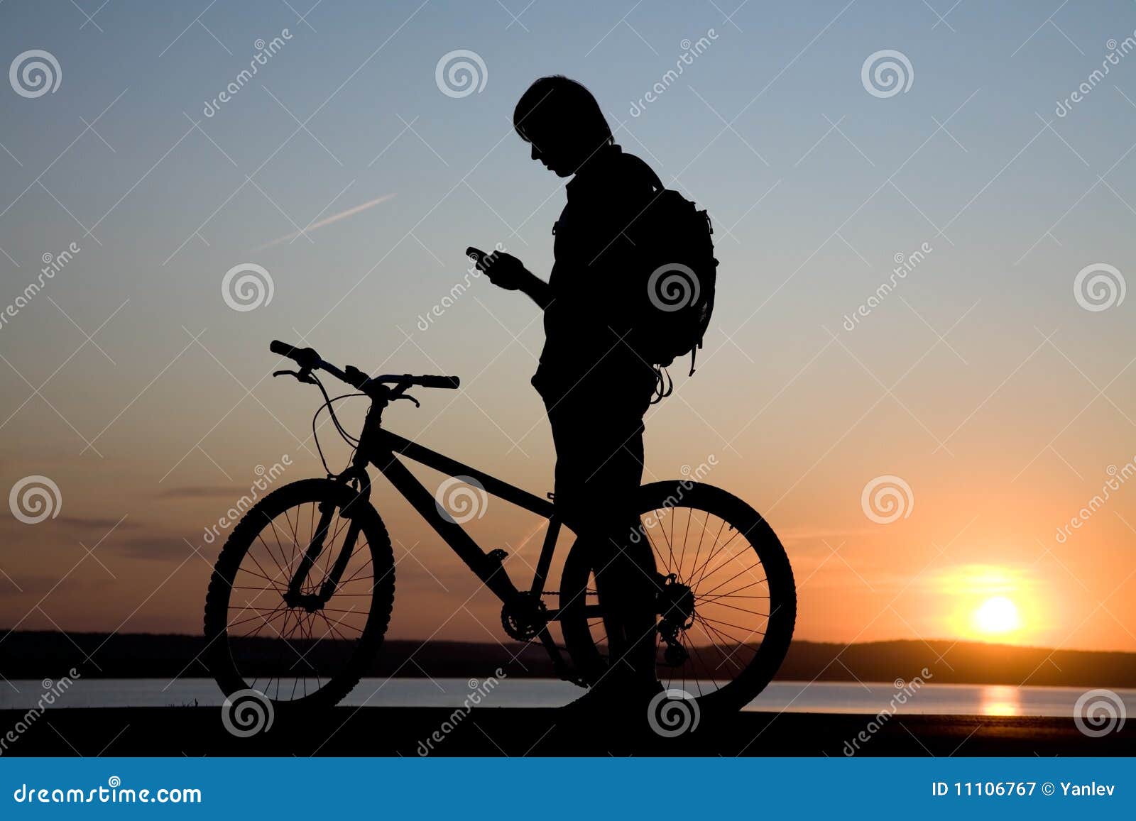 Bicycler call by phone stock image. Image of water, adult - 11106767