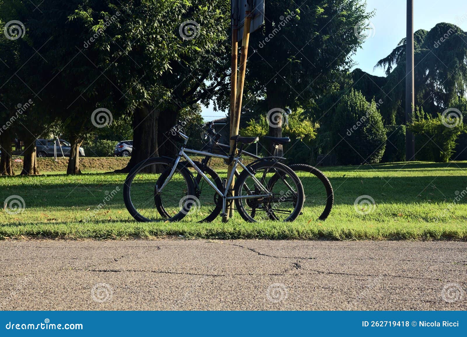 Bicycles Chained To a Pole on an Open Space Stock Photo - Image of ...