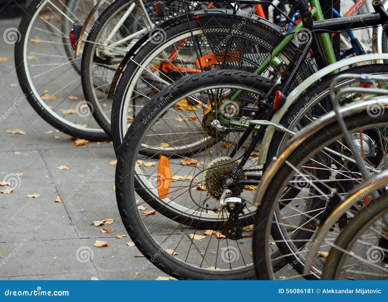 Bicycles parked on street stock image. Image of city - 56086181