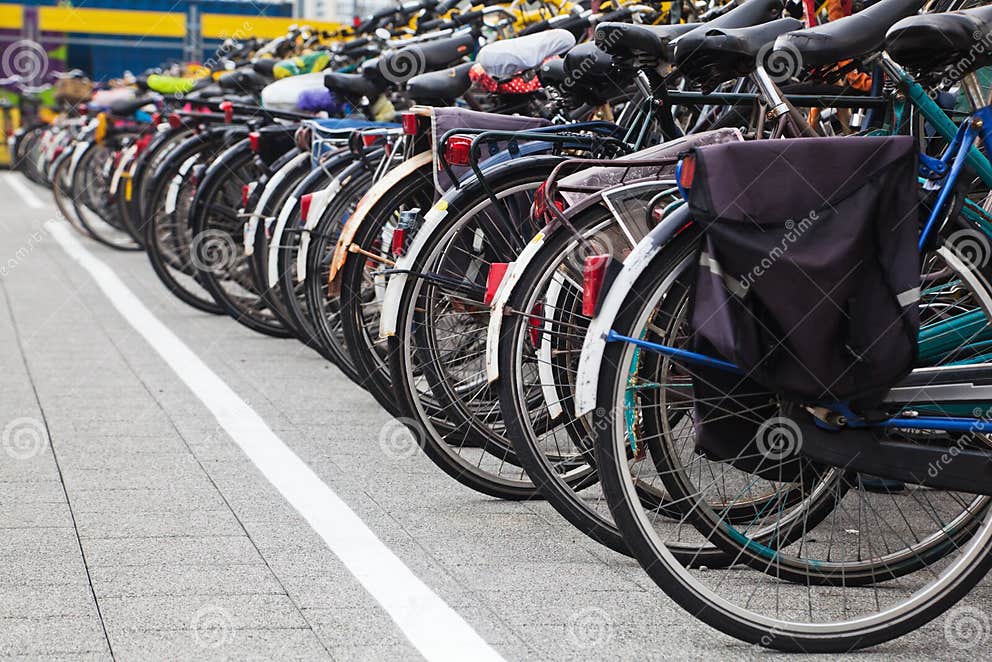 Bicycles in a row stock photo. Image of pavement, bicycle - 34162782