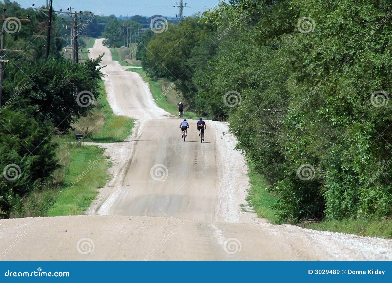 Bicycling on country road stock image. Image of biking - 3029489