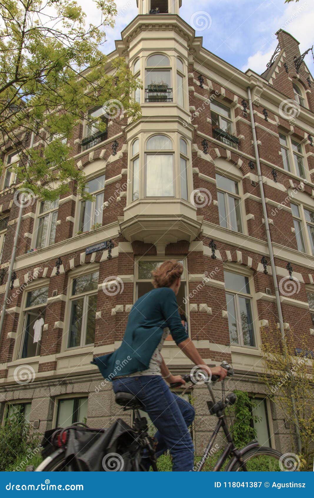 Bicyclist in Amsterdam editorial photography. Image of bike - 118041387