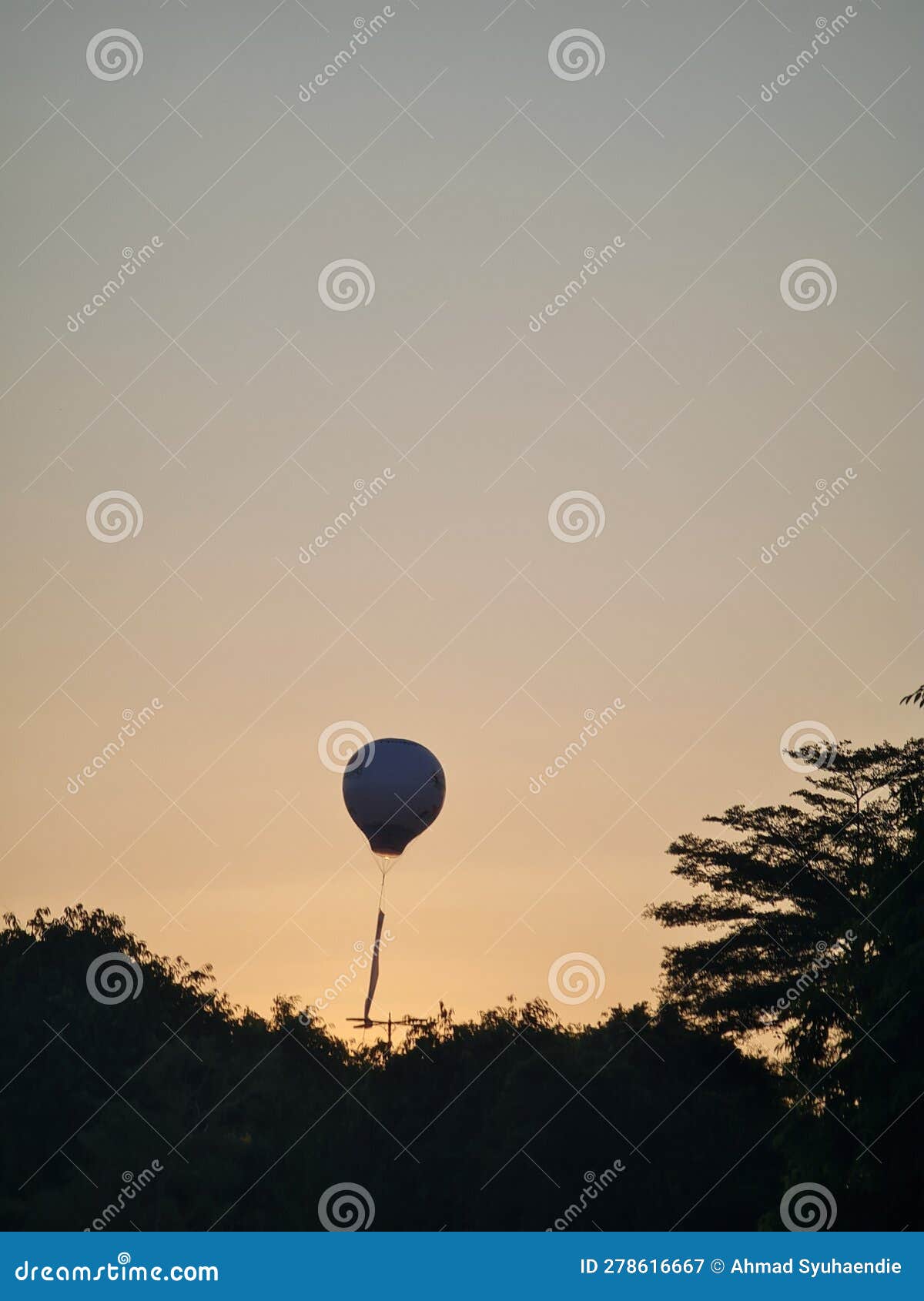 Big Balloon Appears in the Sunset Sky Stock Image - Image of sunset ...
