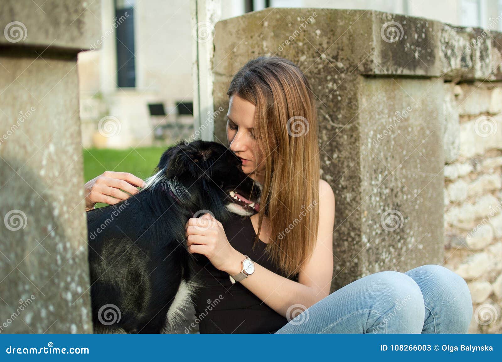 Big Black Dog Spending Time with Its Owner Outdoors during Summer Day ...