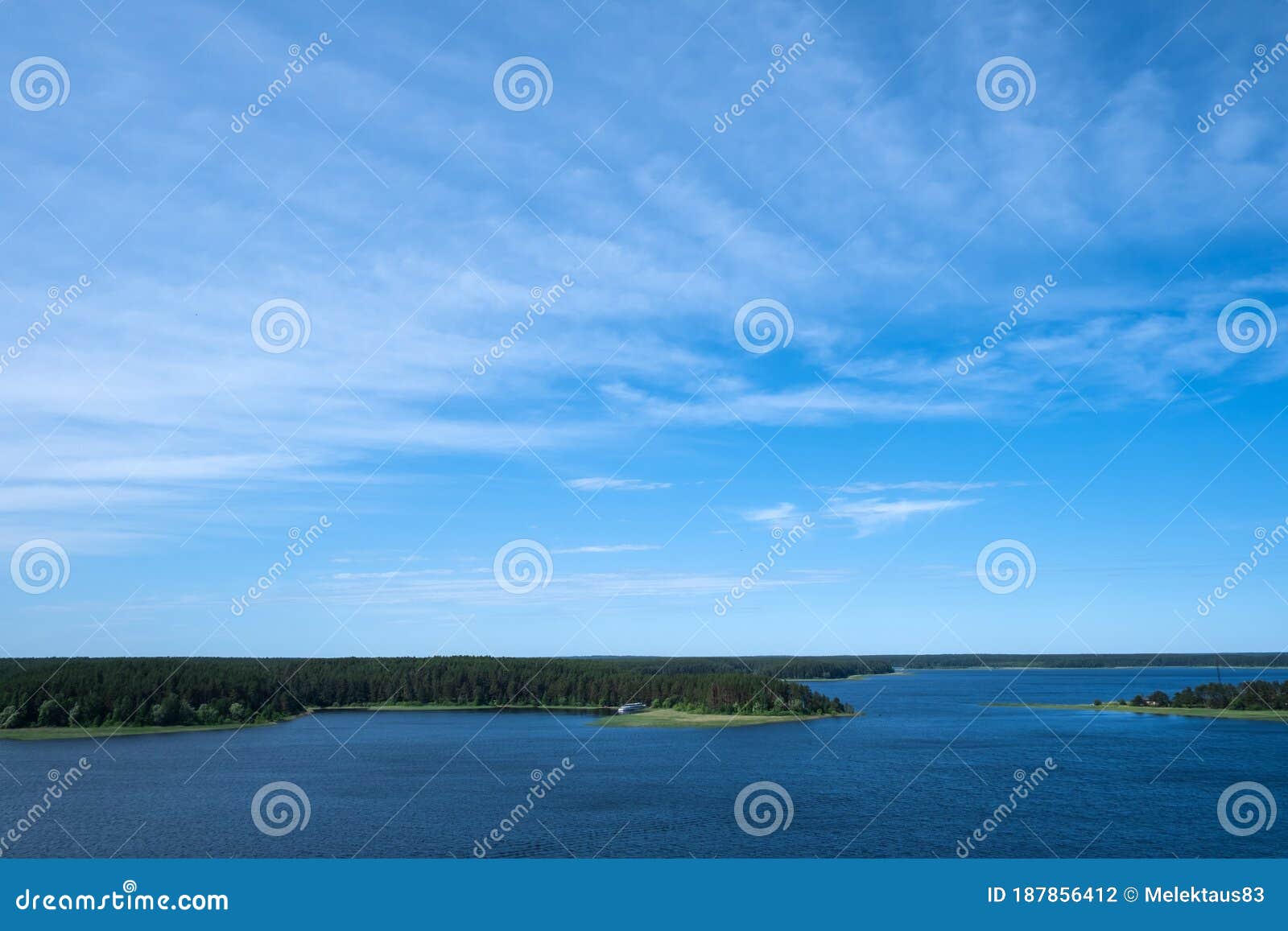 Big blue lake and blue sky stock photo. Image of lake - 187856412