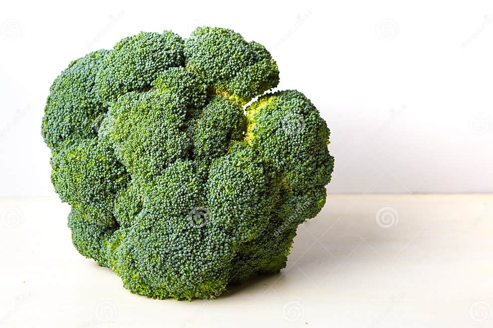 Big Broccoli on a Wooden Table Stock Photo - Image of eating, juicy ...