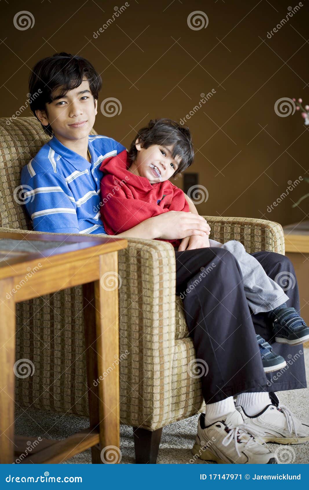 Big Brother Caring for Disabled Sibling Stock Image - Image of male ...