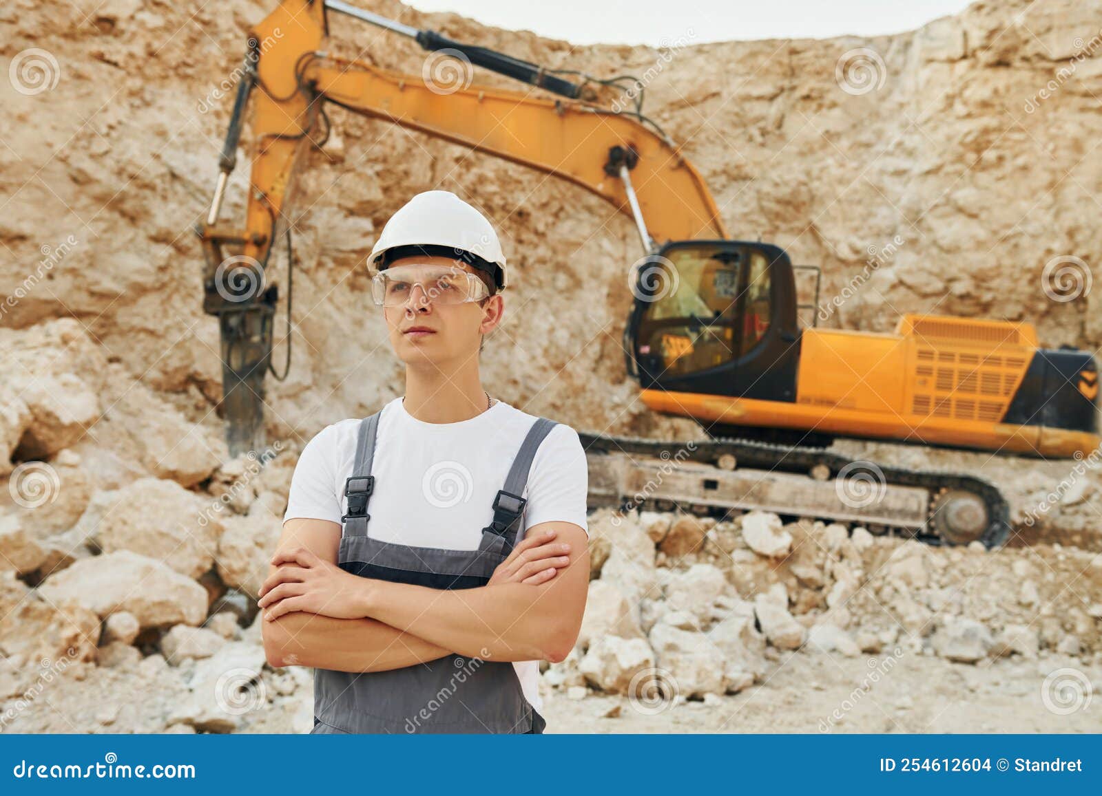 Big Career. Worker in Professional Uniform is on the Borrow Pit at ...