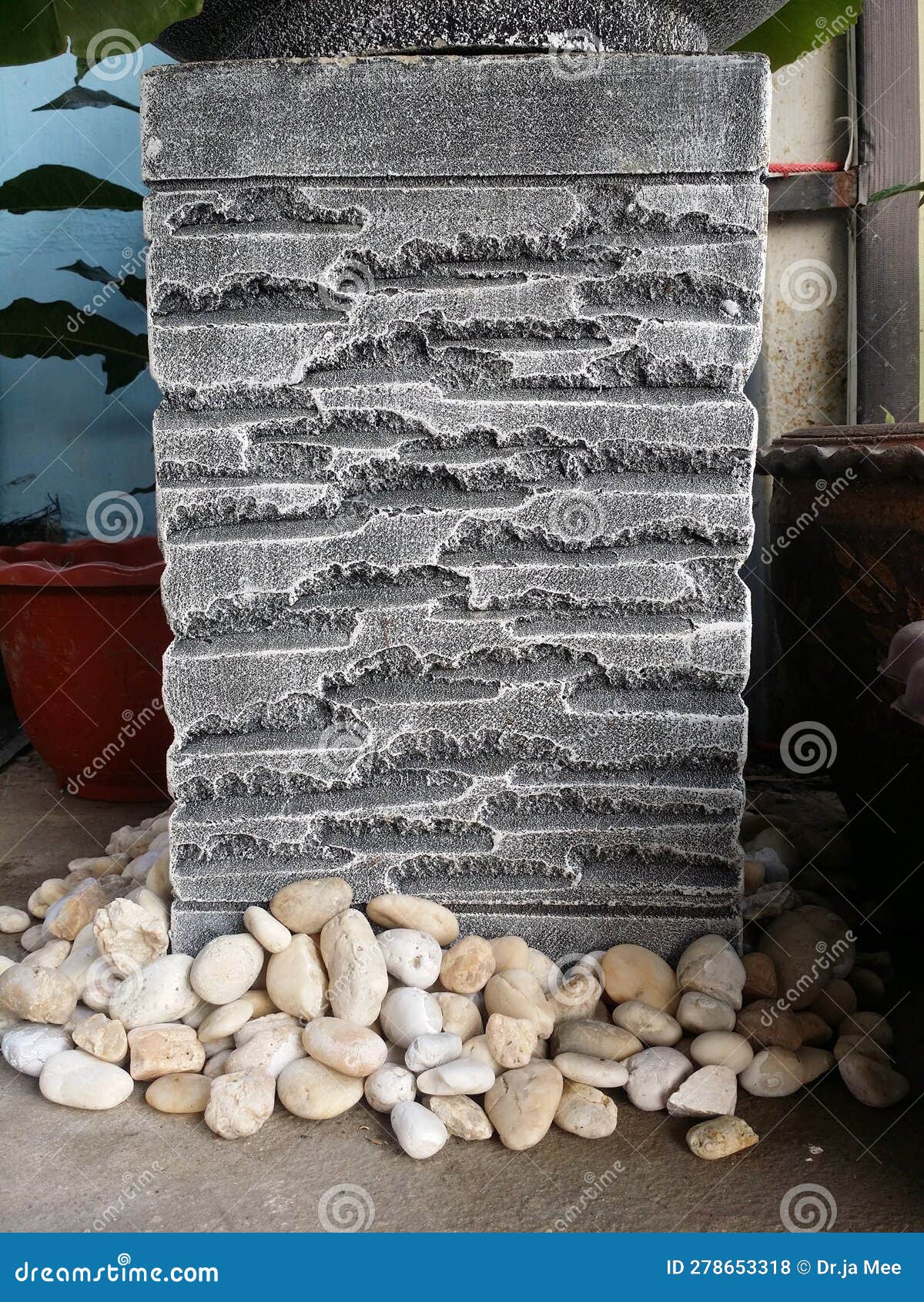Big Carving Rectangular Granite Rock and Brown Pebbles Stones on Ground ...