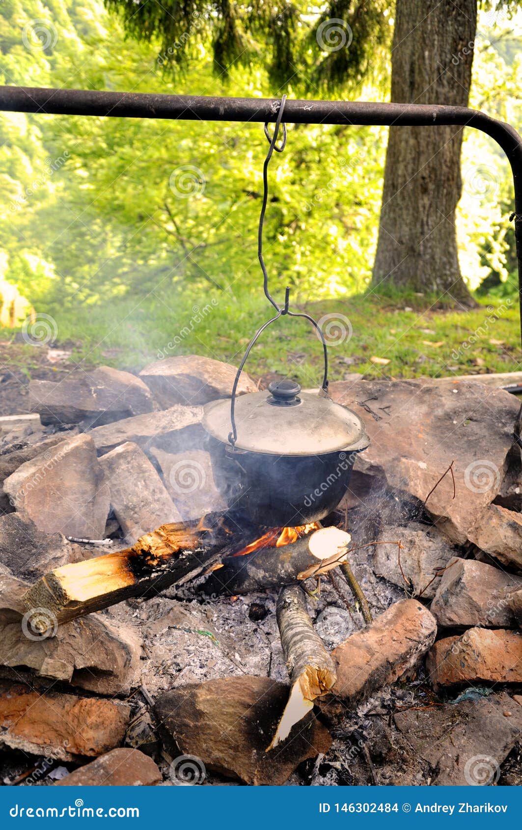 Big cauldron over the fire stock photo. Image of mountains - 146302484