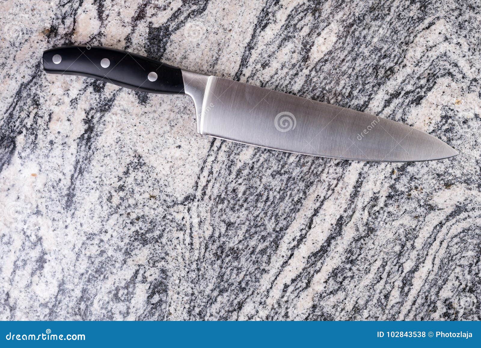 Big Chef Knife on the Grey Granite Background Table Stock Photo - Image ...