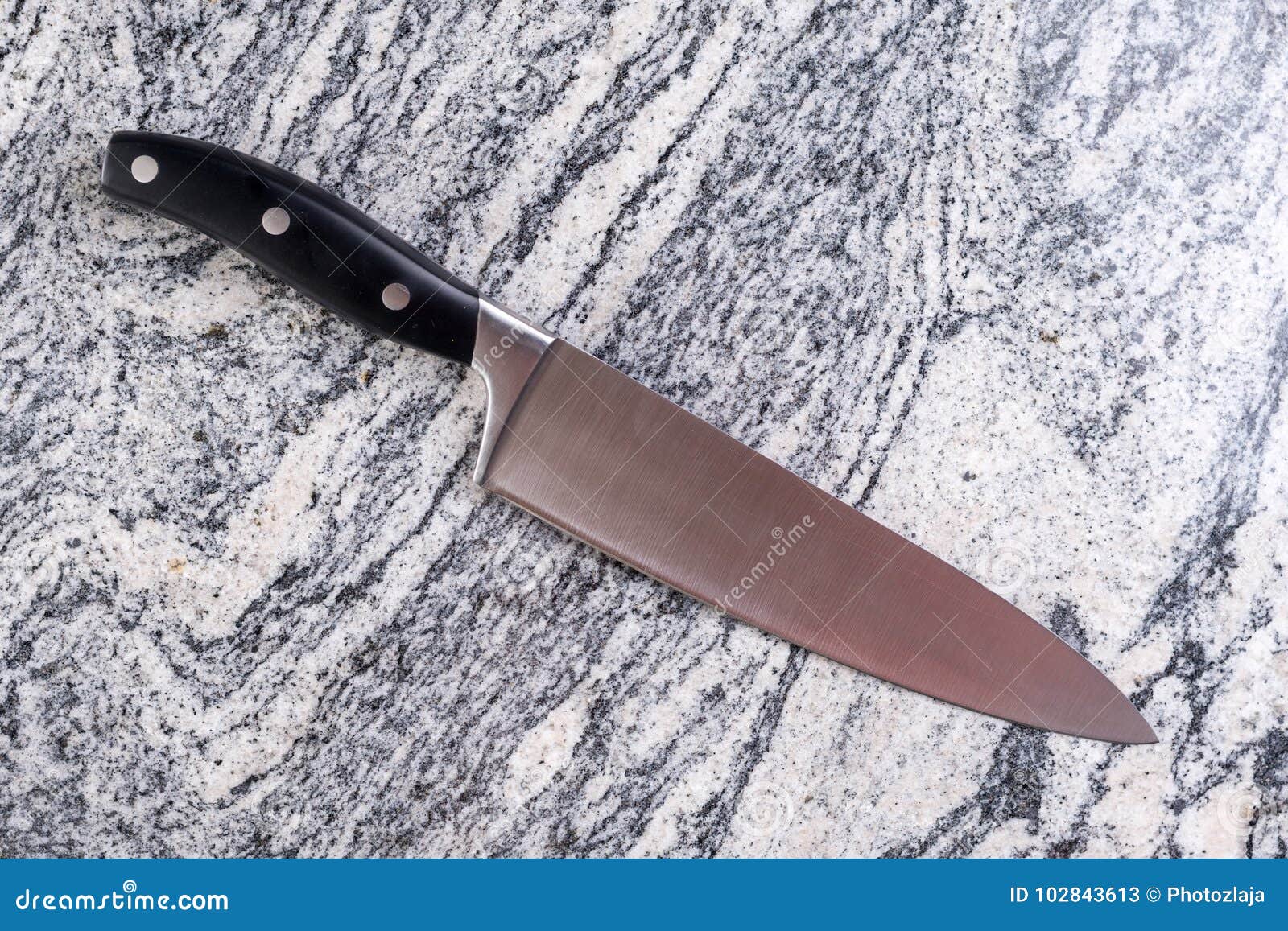 Big Chef Knife on the Grey Granite Background Table Stock Image - Image ...