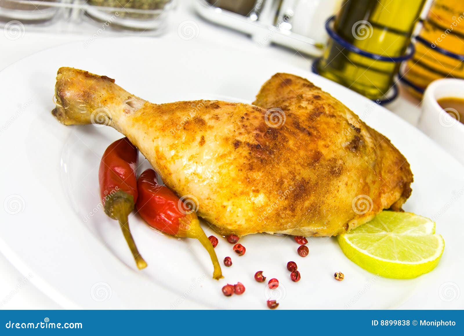 A Big Chicken Leg- Roasted With Red Peppers Stock Photo - Image of ...