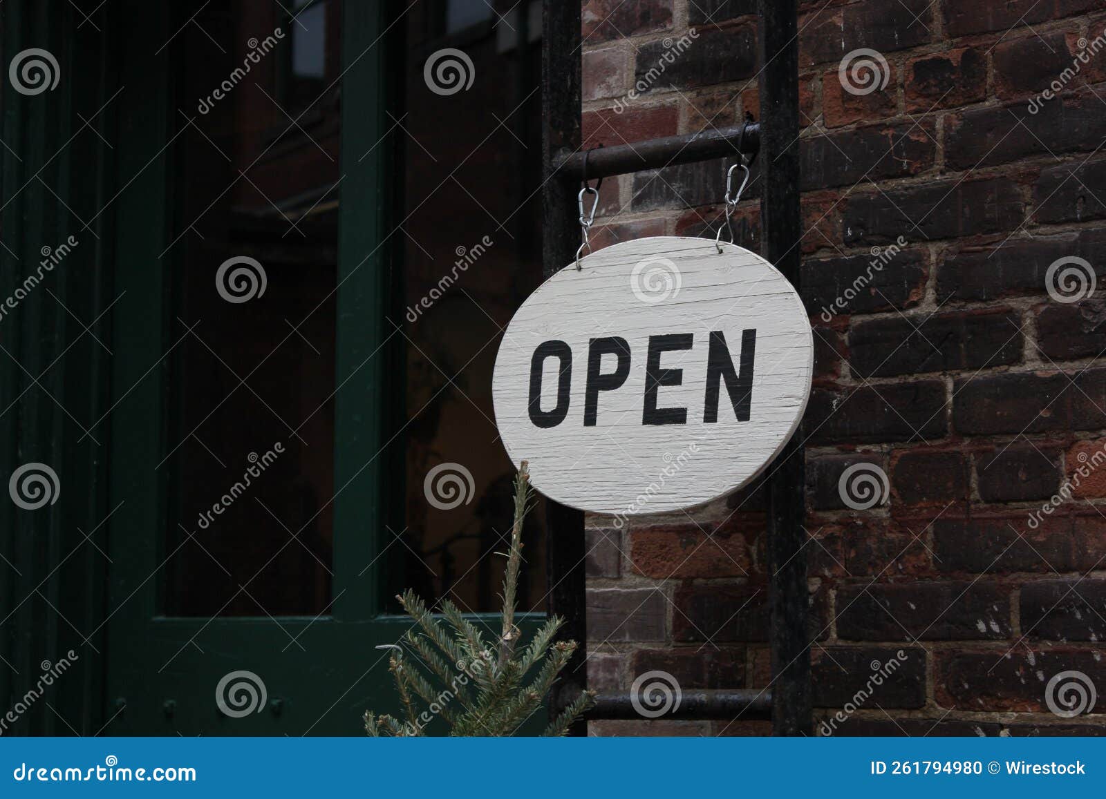 Big Circular Wooden Open Sign Hanging in Front of a Building Stock ...