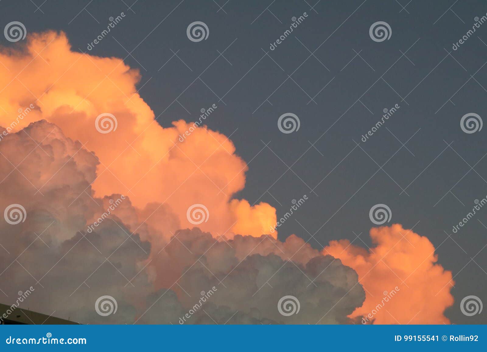 Clouds lit up by sunset stock image. Image of imagine - 99155541