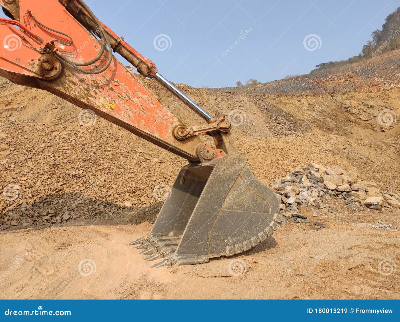 Big Digging Bucket of Backhoe or Excavator beside Stone Pile Stock ...