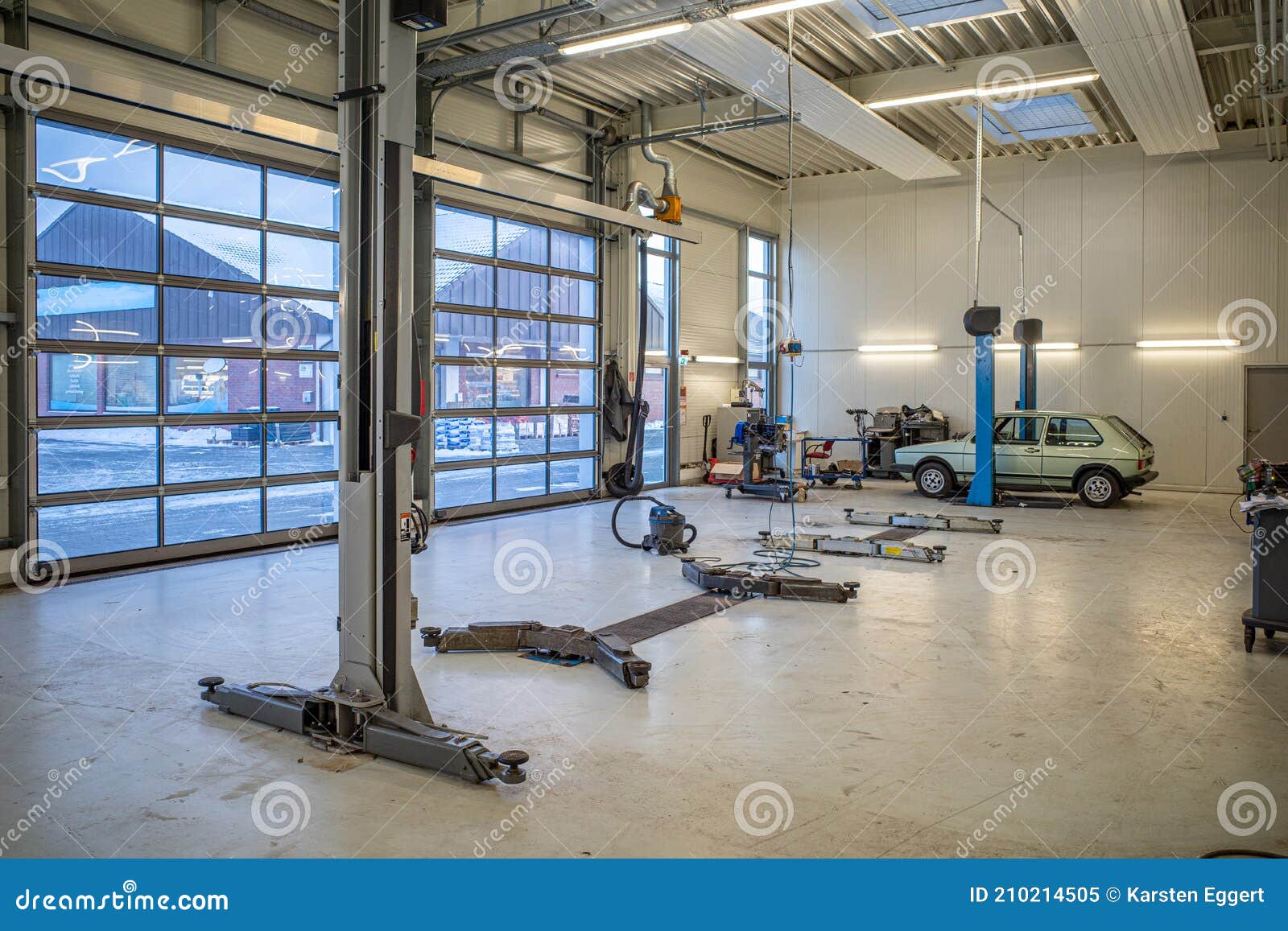 In Big Empty Car Workshop There are Some Car Lifts Stock Image - Image ...