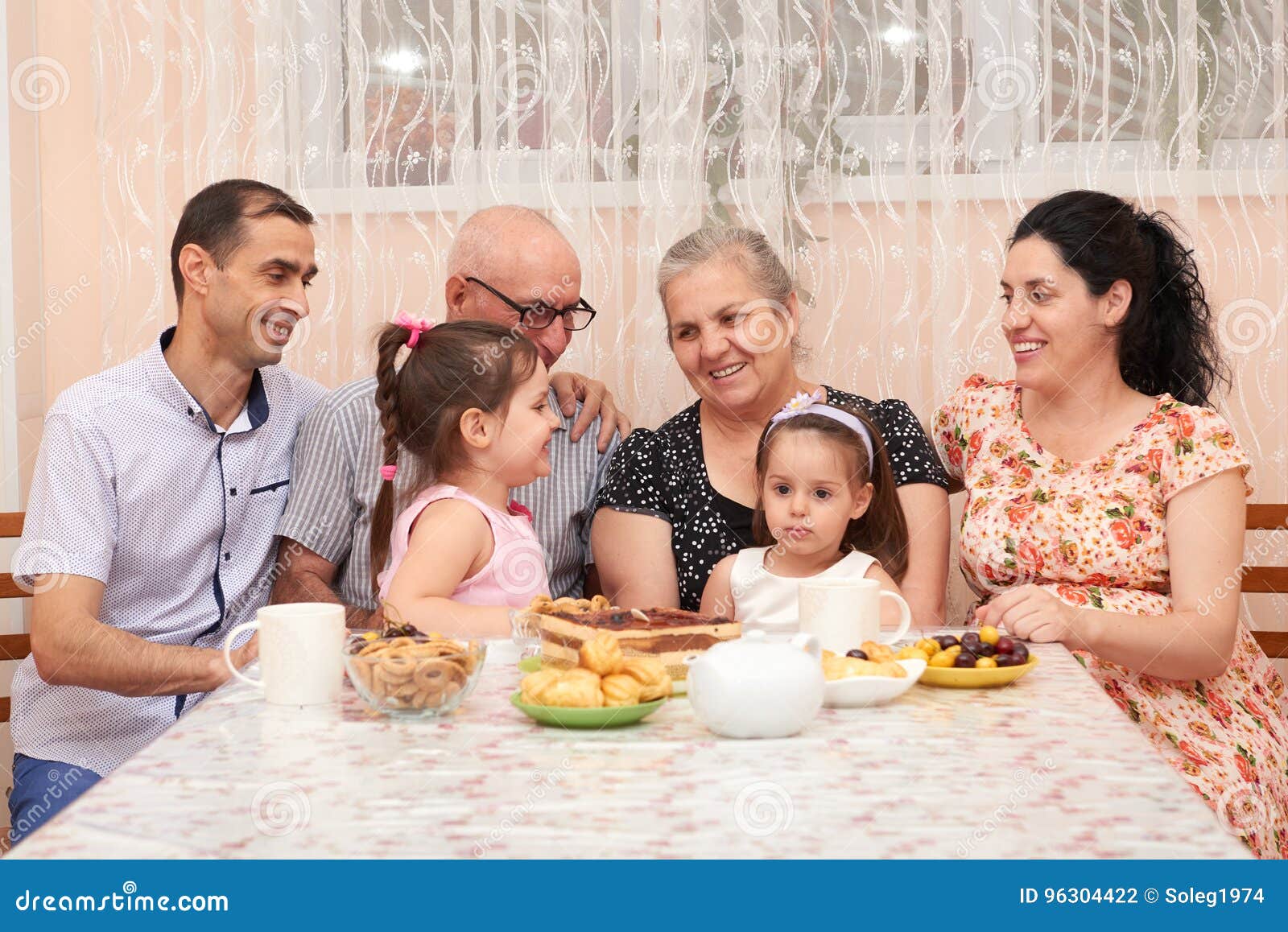 Big Family Drinking Tea in Dining Room Stock Photo - Image of girl ...