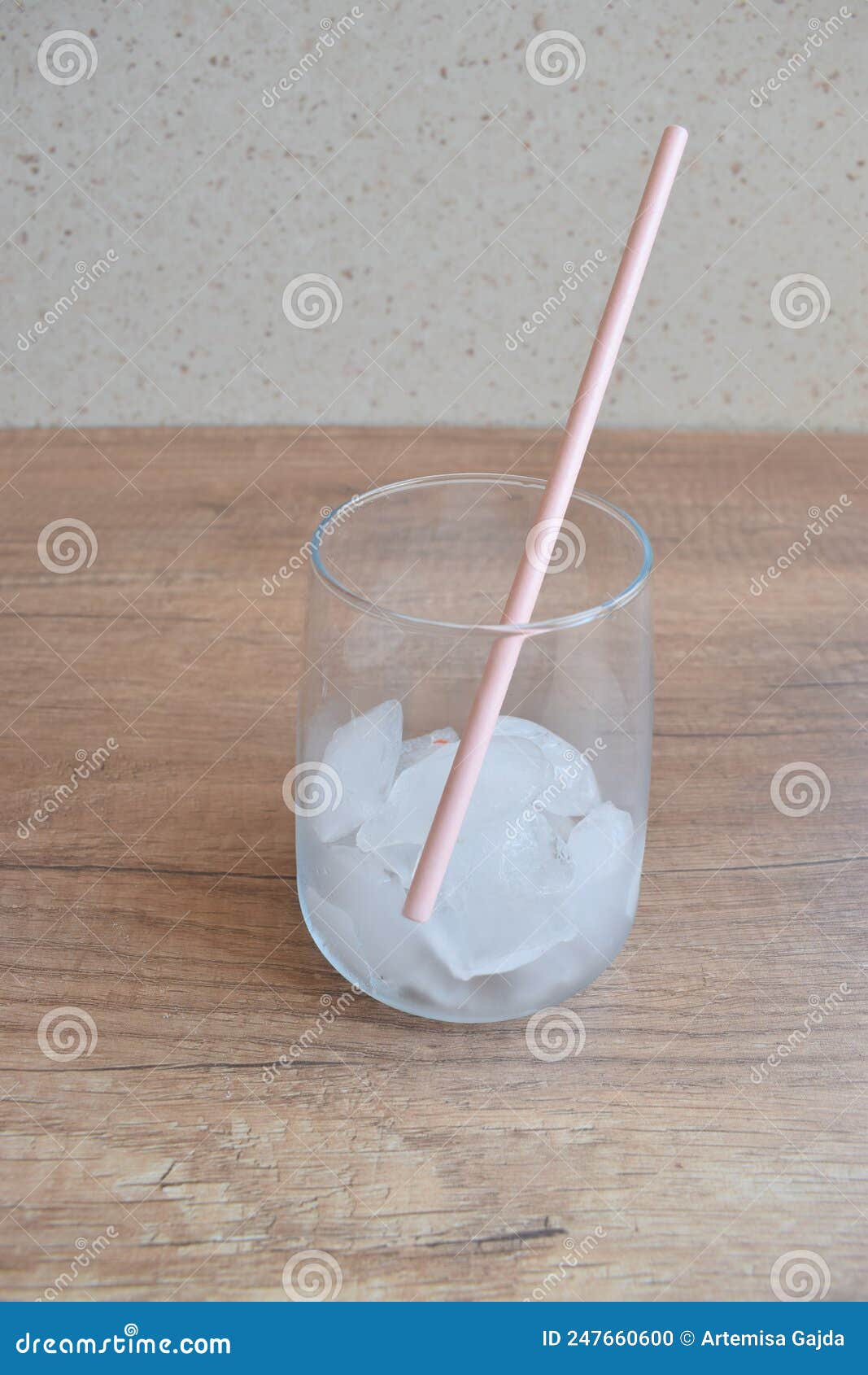 A Big Glass, Full with Ice Cubes and Cardboard Pipes Stock Photo ...