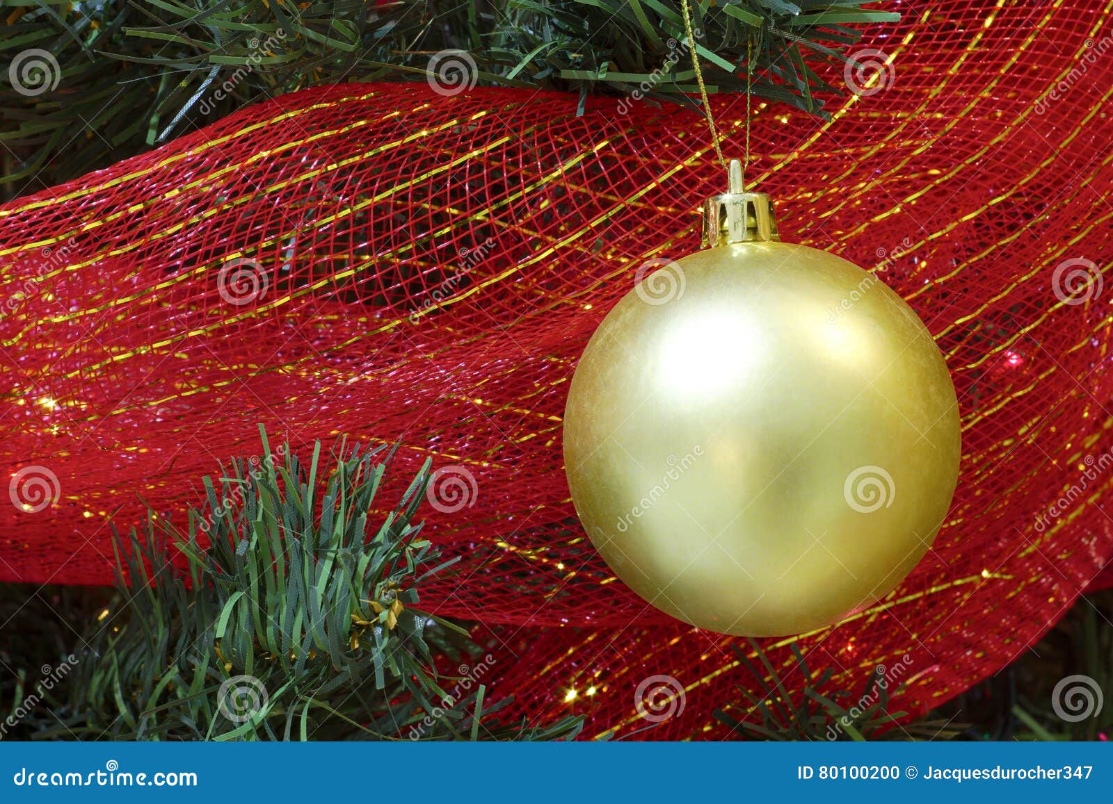 Big Gold Christmas Bauble in a Tree Red Ribbon Stock Photo - Image of ...