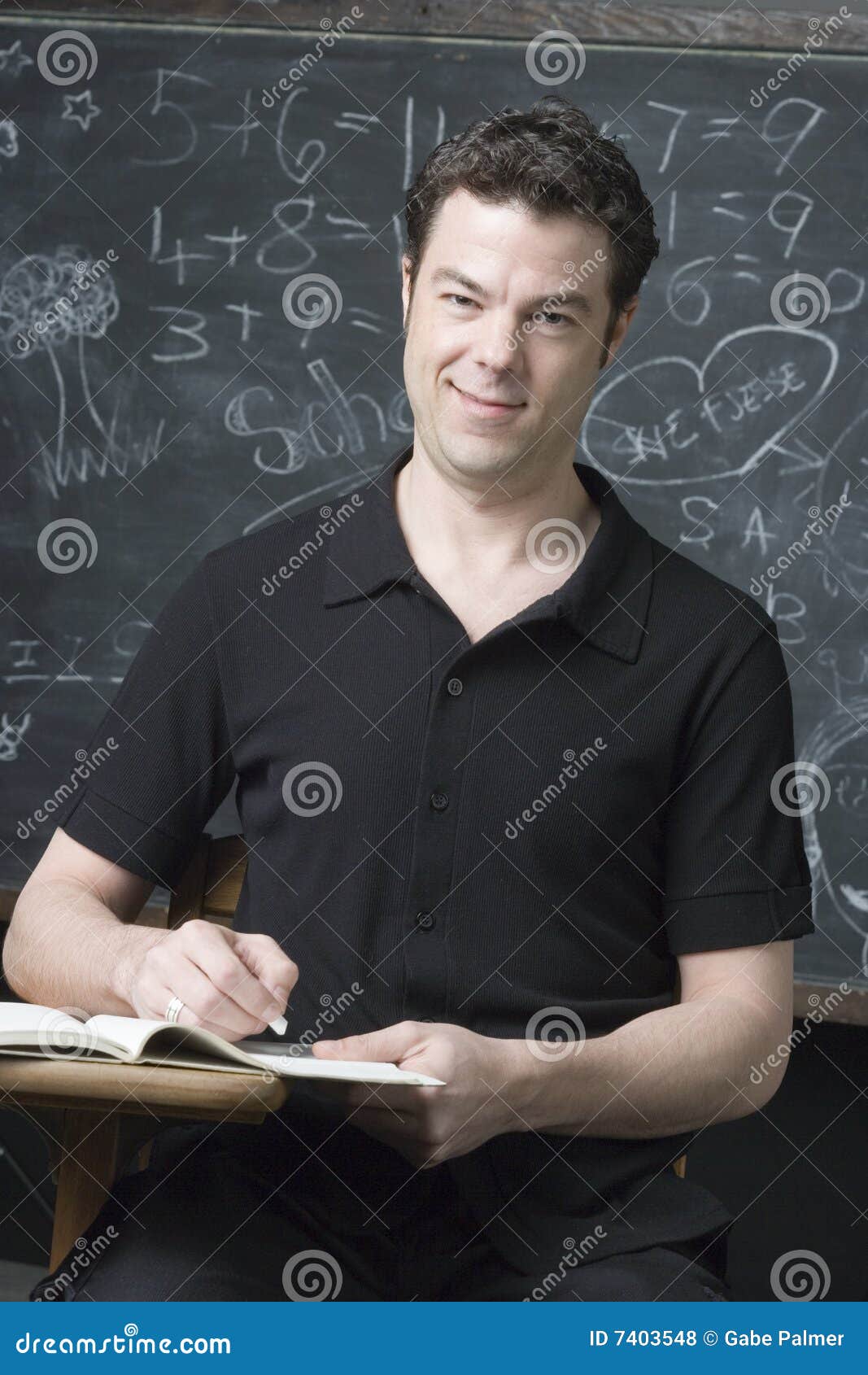 Big Guy Sits at a Little School Desk Stock Photo - Image of adult ...