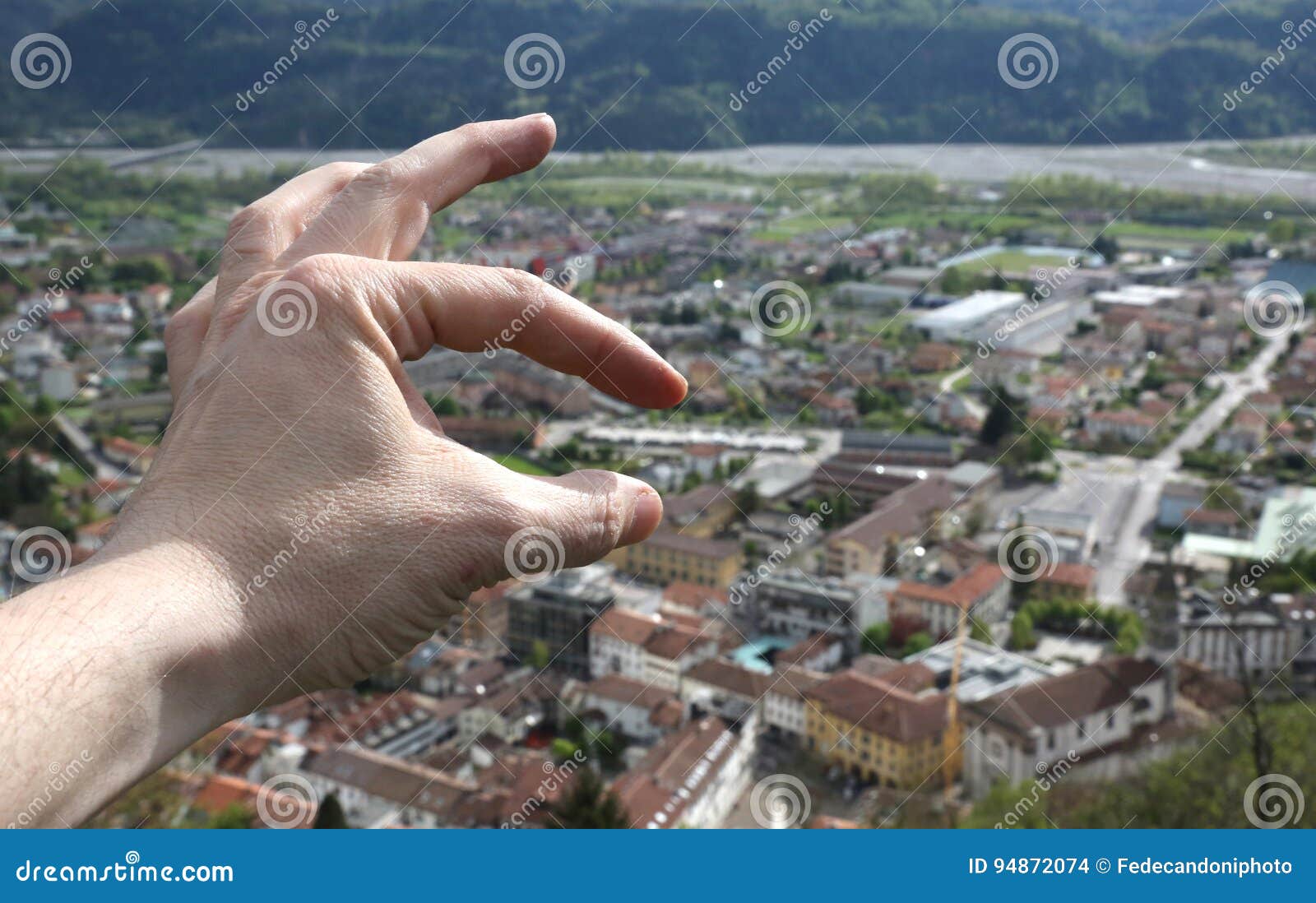 Big hand over the town stock photo. Image of scenery - 94872074