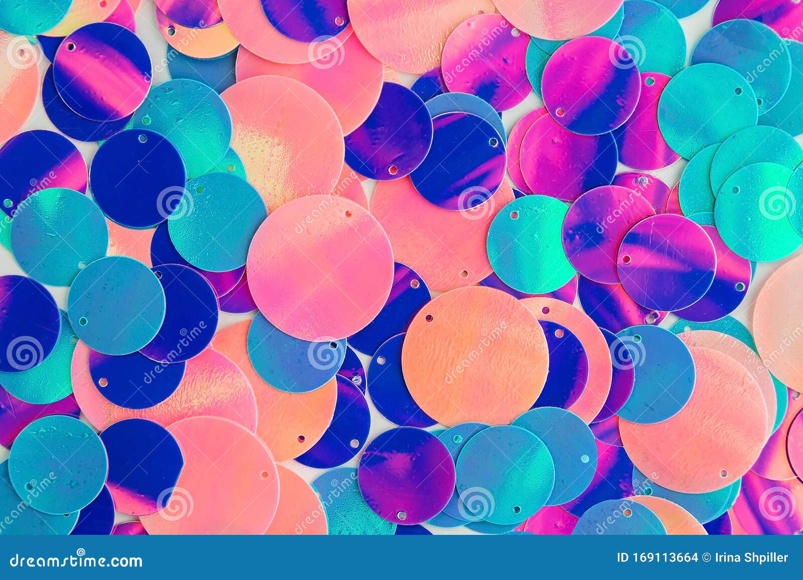 Big Holographic Sequins on Pale Orange Background Stock Photo - Image ...