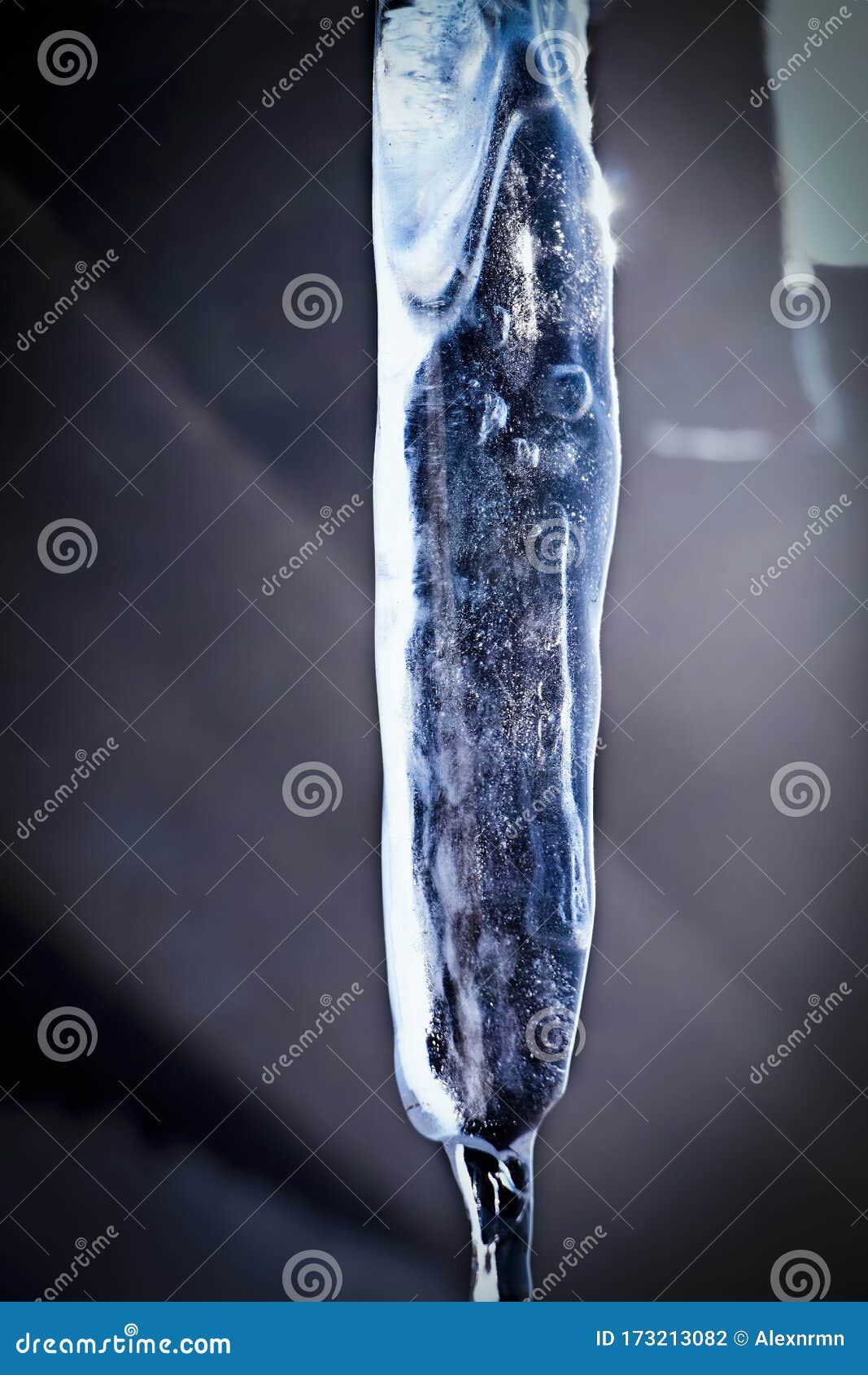 Big Icicle on a Blue Background. Stock Photo - Image of blue, melting ...