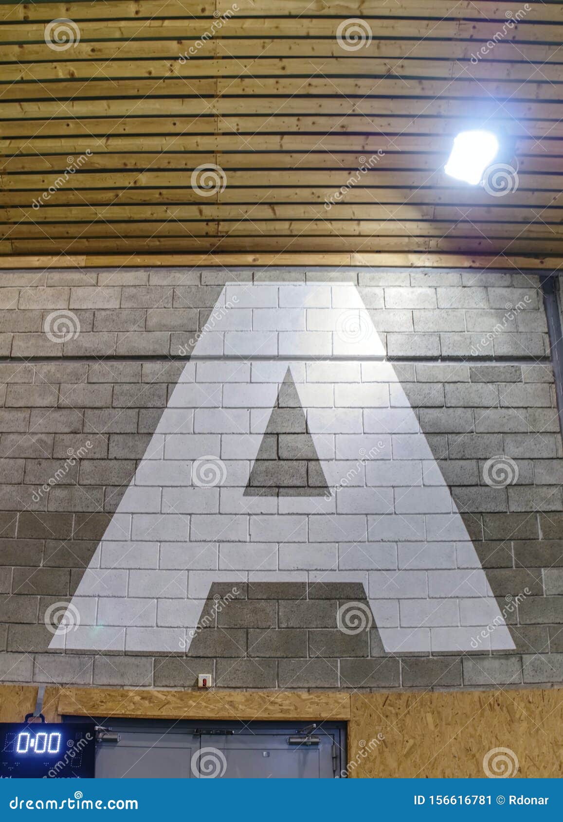 Big Letter Painted On Brick Hall Wall For Devide Room For Sections ...