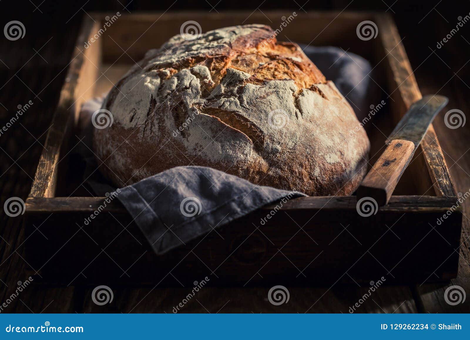 Big Loaf of Bread on Dark Table Stock Photo - Image of baked, rustic ...