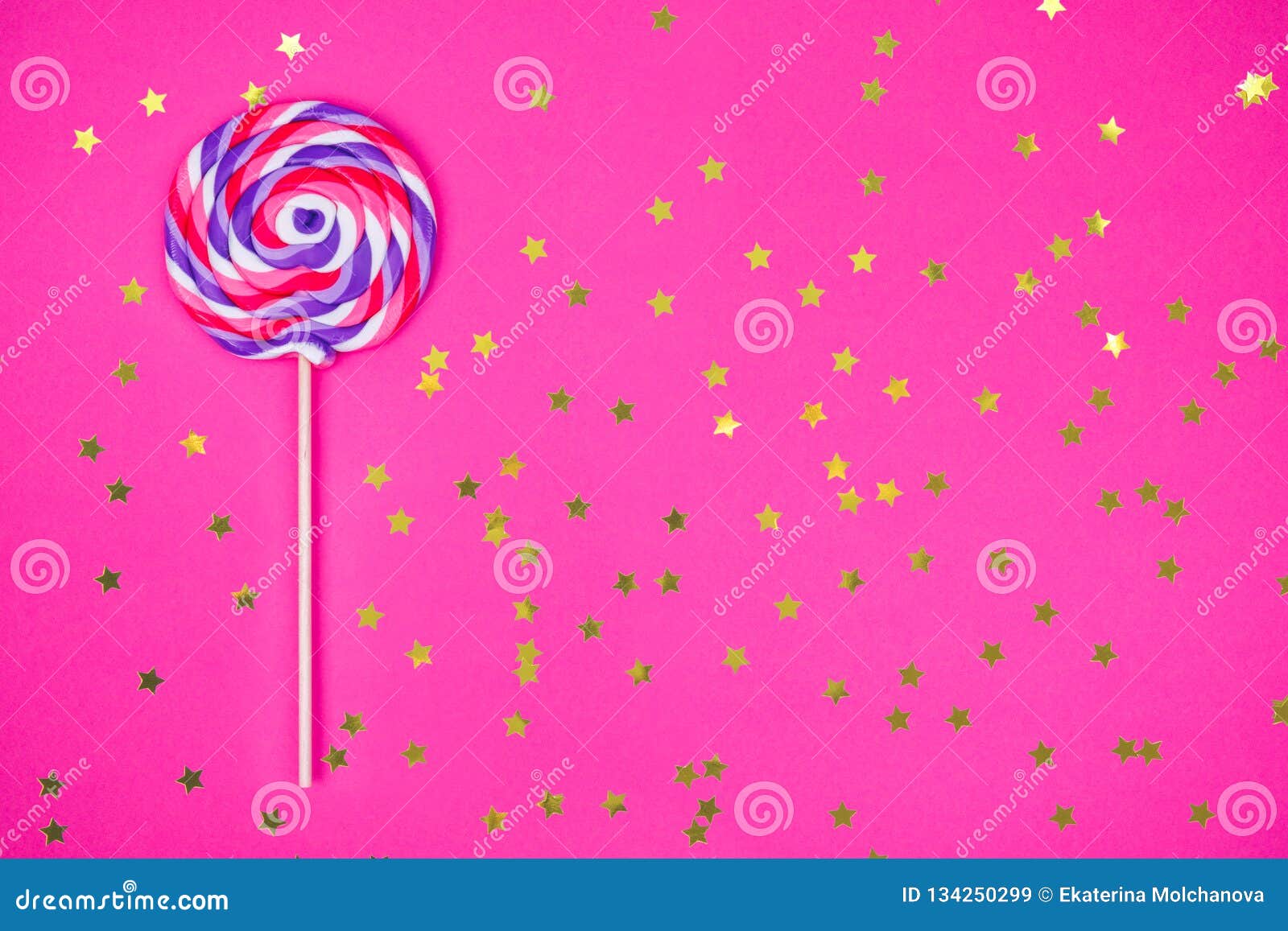 Big Lollipop on Solid Pink Background with Golden Sprinkles Stock Image ...