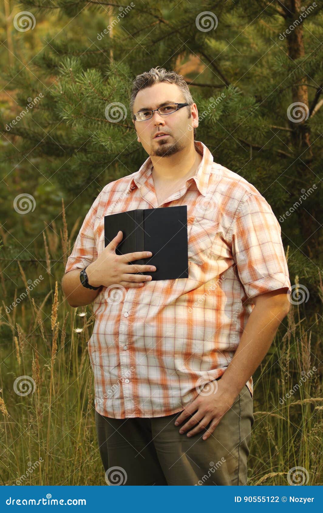 Big Man Reading Book and Thinking in the Forest Stock Photo - Image of ...