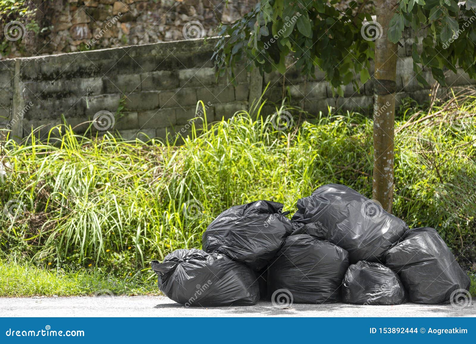 Big and Many Plastic Garbage Bag on Streets with Garbage Sitting on ...