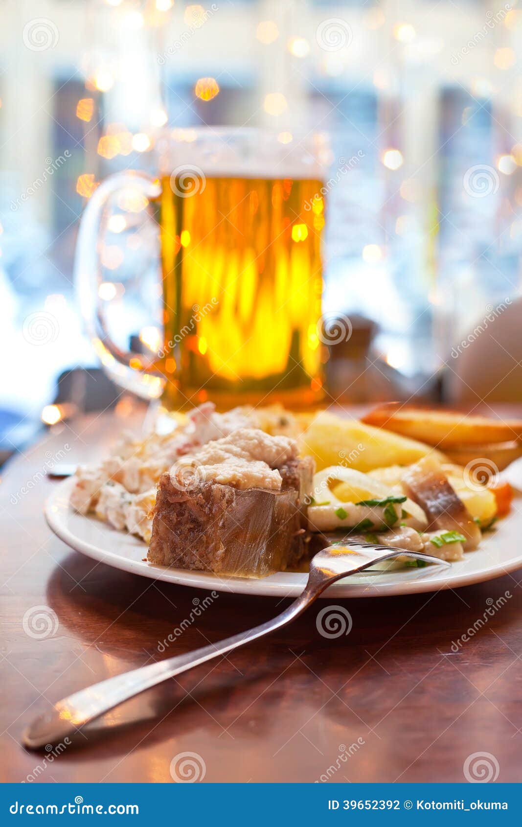 The Big Mug of Beer and Cold Dishes on a Little Table at Restaurant ...
