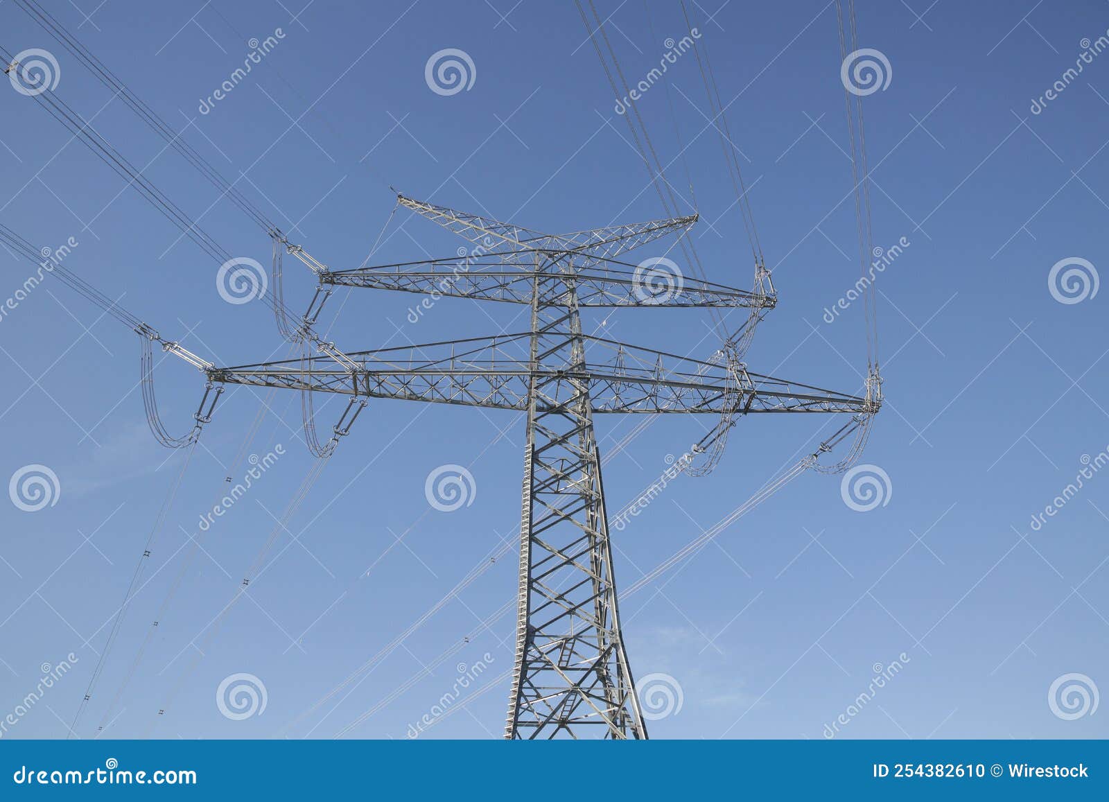 A Big Nuclear Power Plant Power Pole and a Blue Cloudless Sky Stock ...