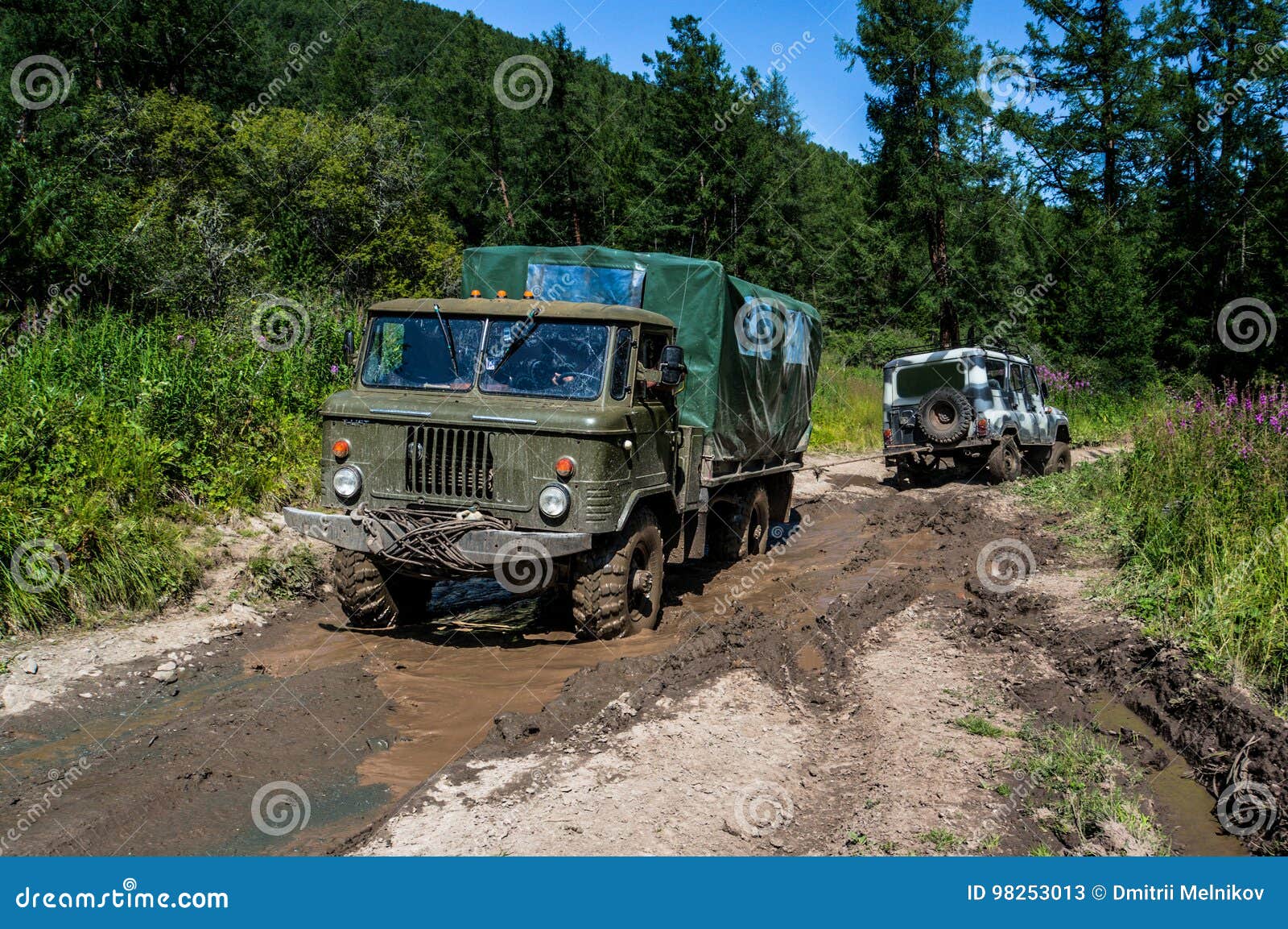 Big Off-road Truck Pulls Pross Small SUV. Stock Image - Image of ...