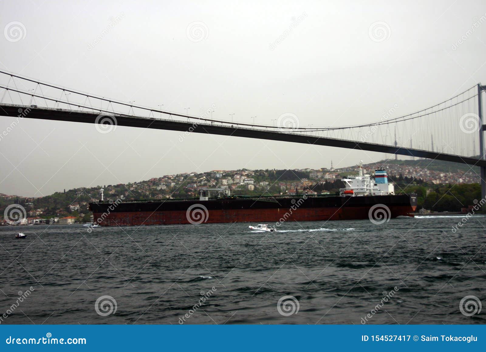 A Big Oil Tanker Passing Under the Bridge in the Bosphorus Stock Image ...