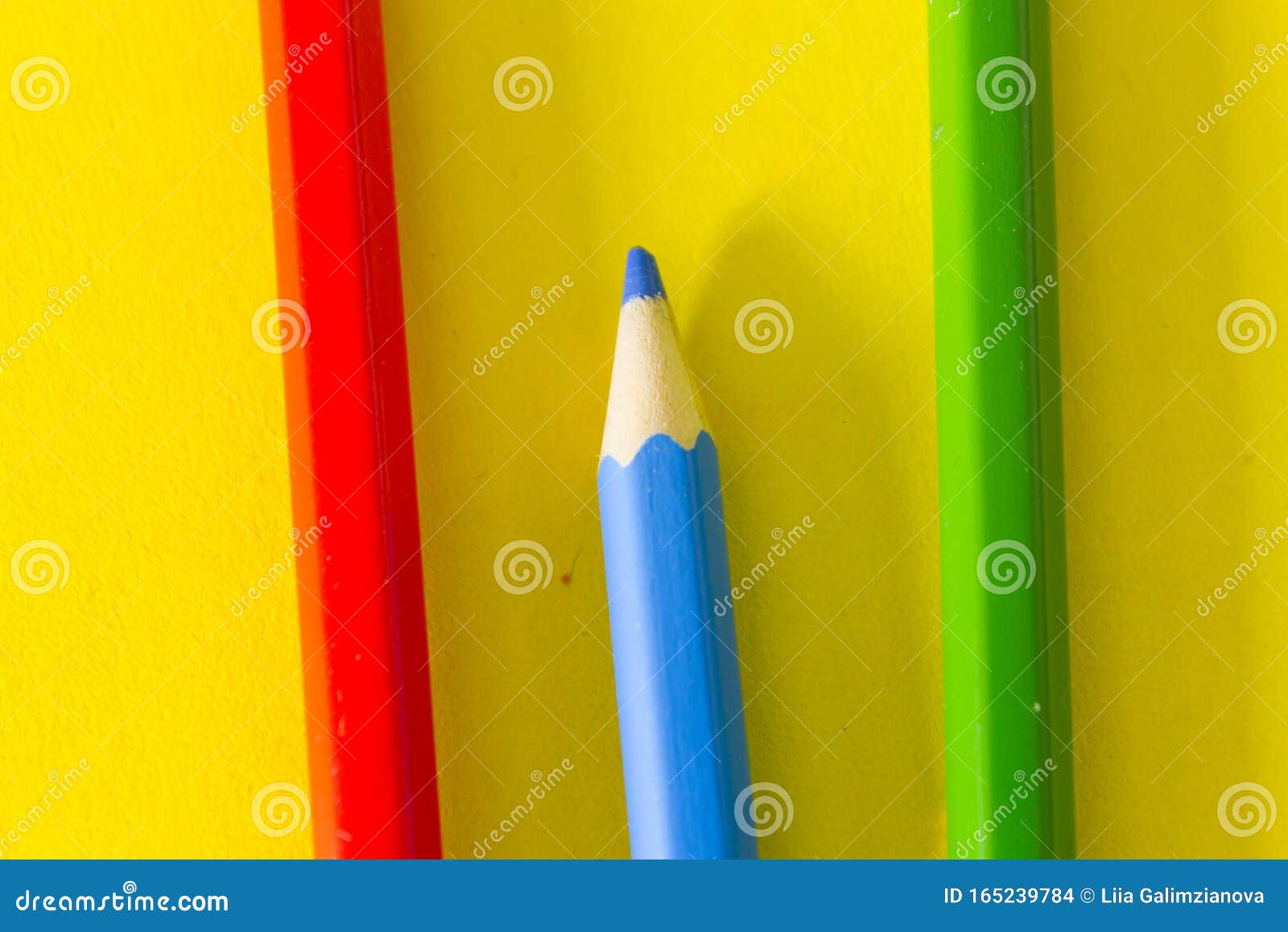 Big pencils and one small stock photo. Image of design - 165239784