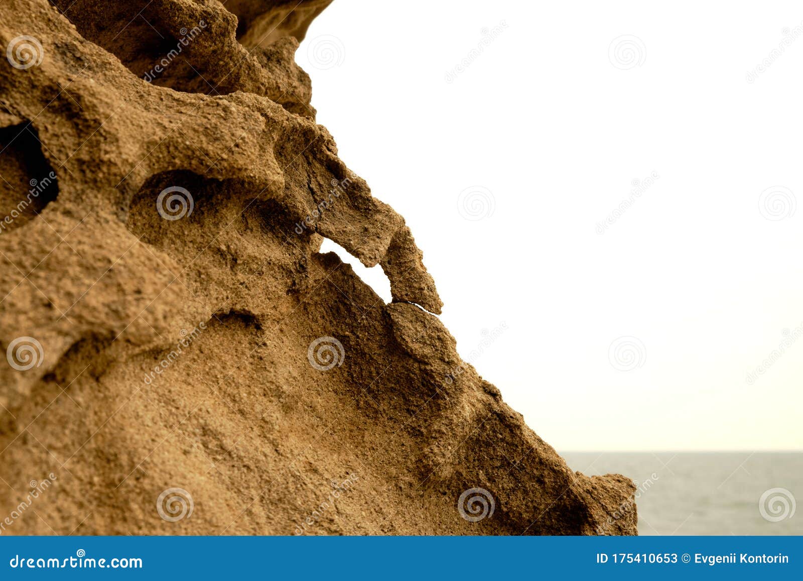 A Big Piece Of Massive Sandstone With Small Eroded Caverns. Foreground ...