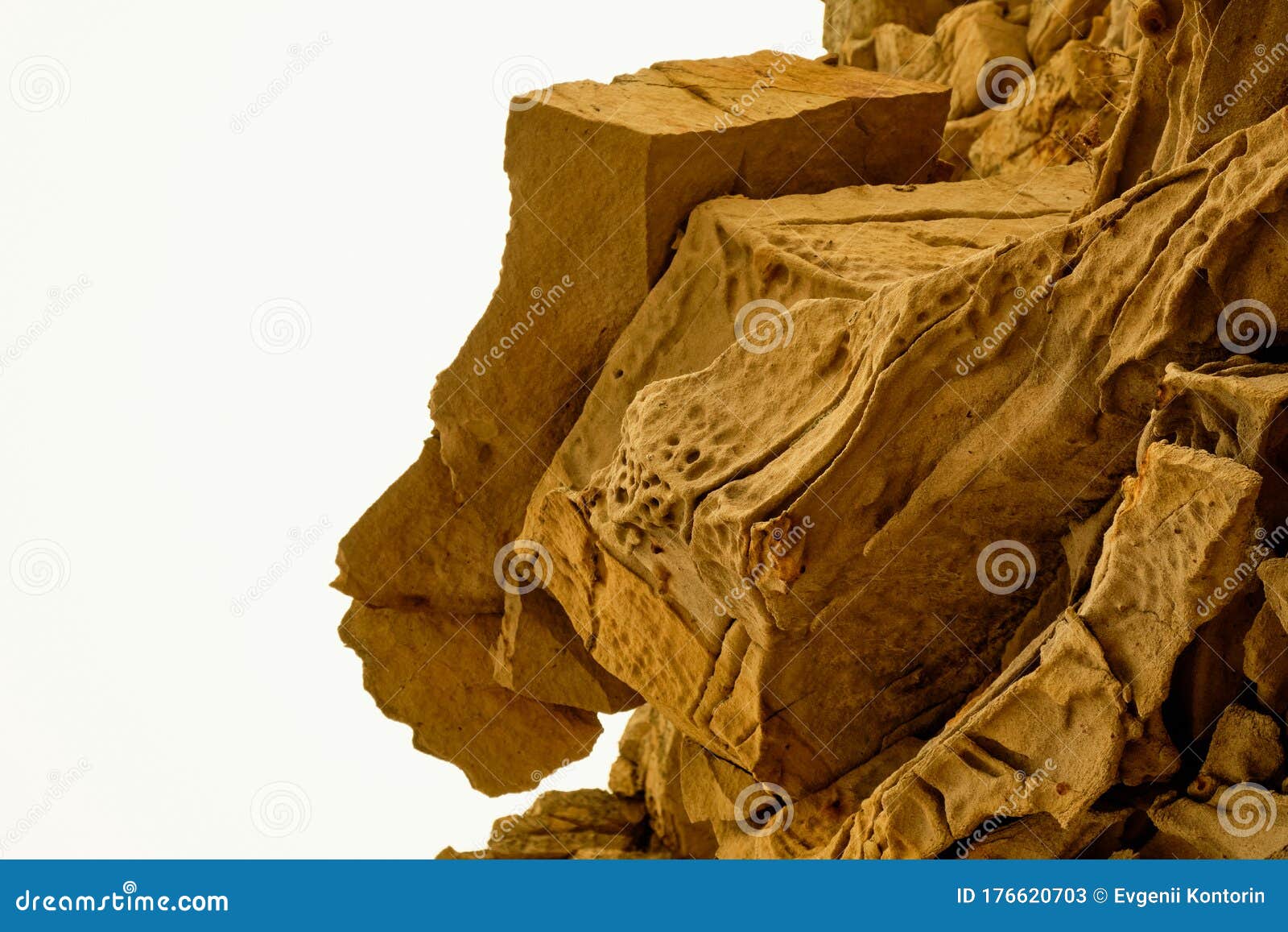 A Big Piece of Massive Sandstone with Small Eroded Caverns. Foreground ...