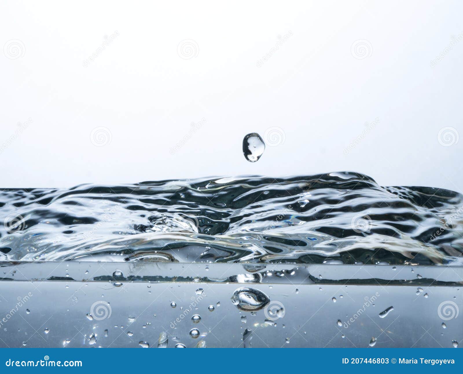 Big Rain Drop Falls on a Wavy Water Surface with a Lot of Splashes ...