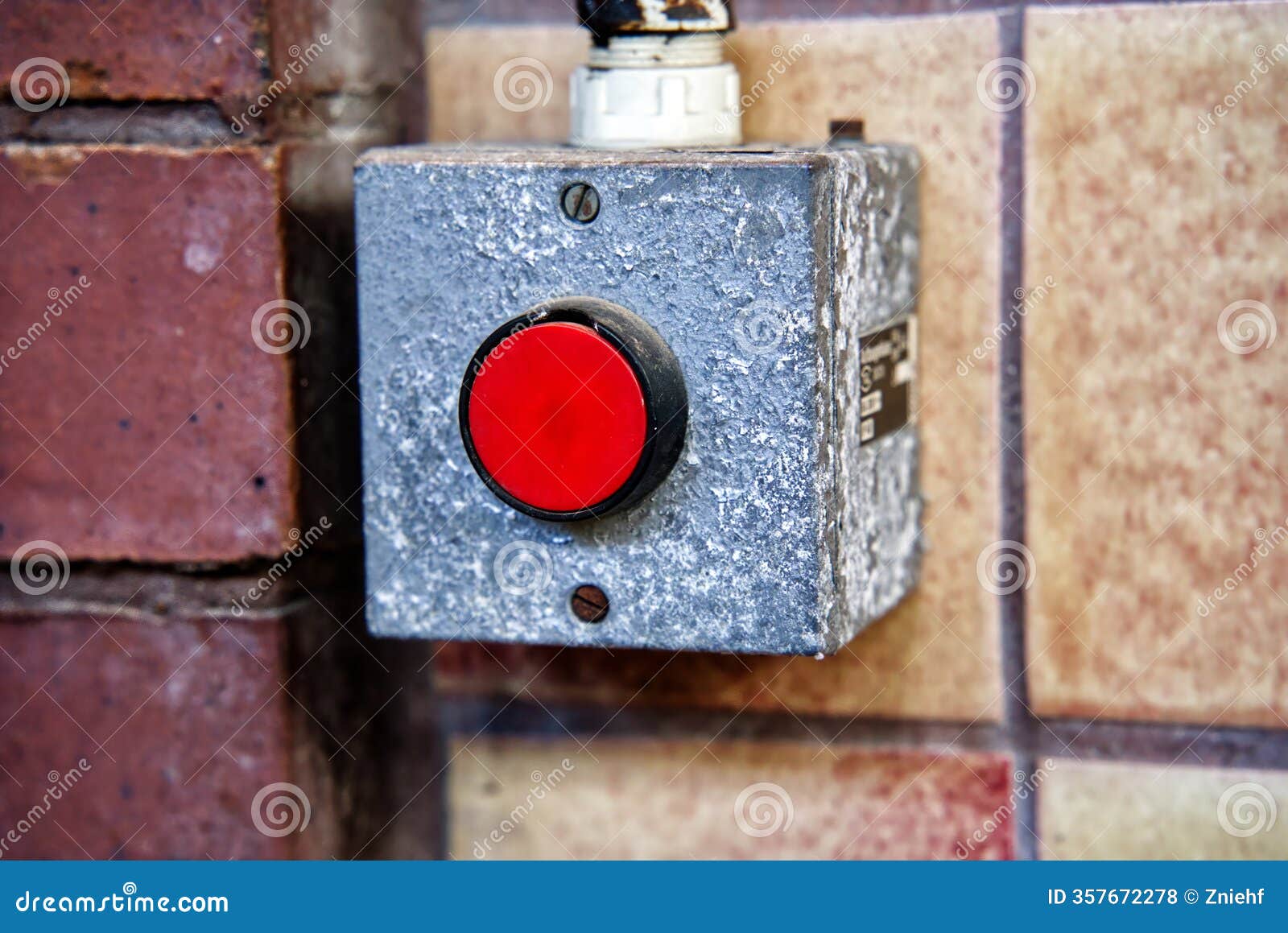 Big Red Button on a Gray Box Fixed on a Tiled Wall Stock Photo - Image ...